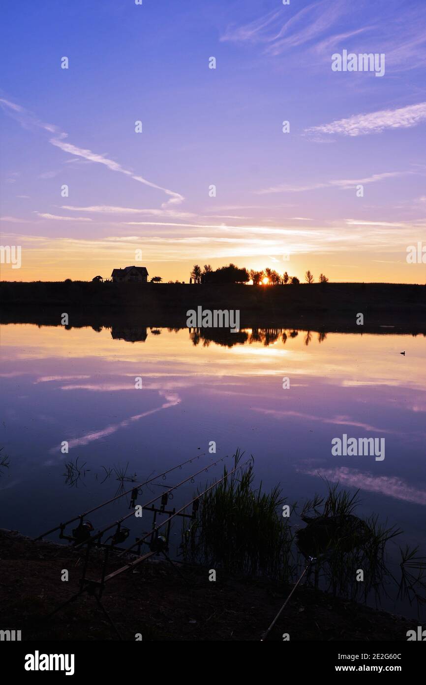 Vertical shot of a beautiful sunset over the water Stock Photo - Alamy