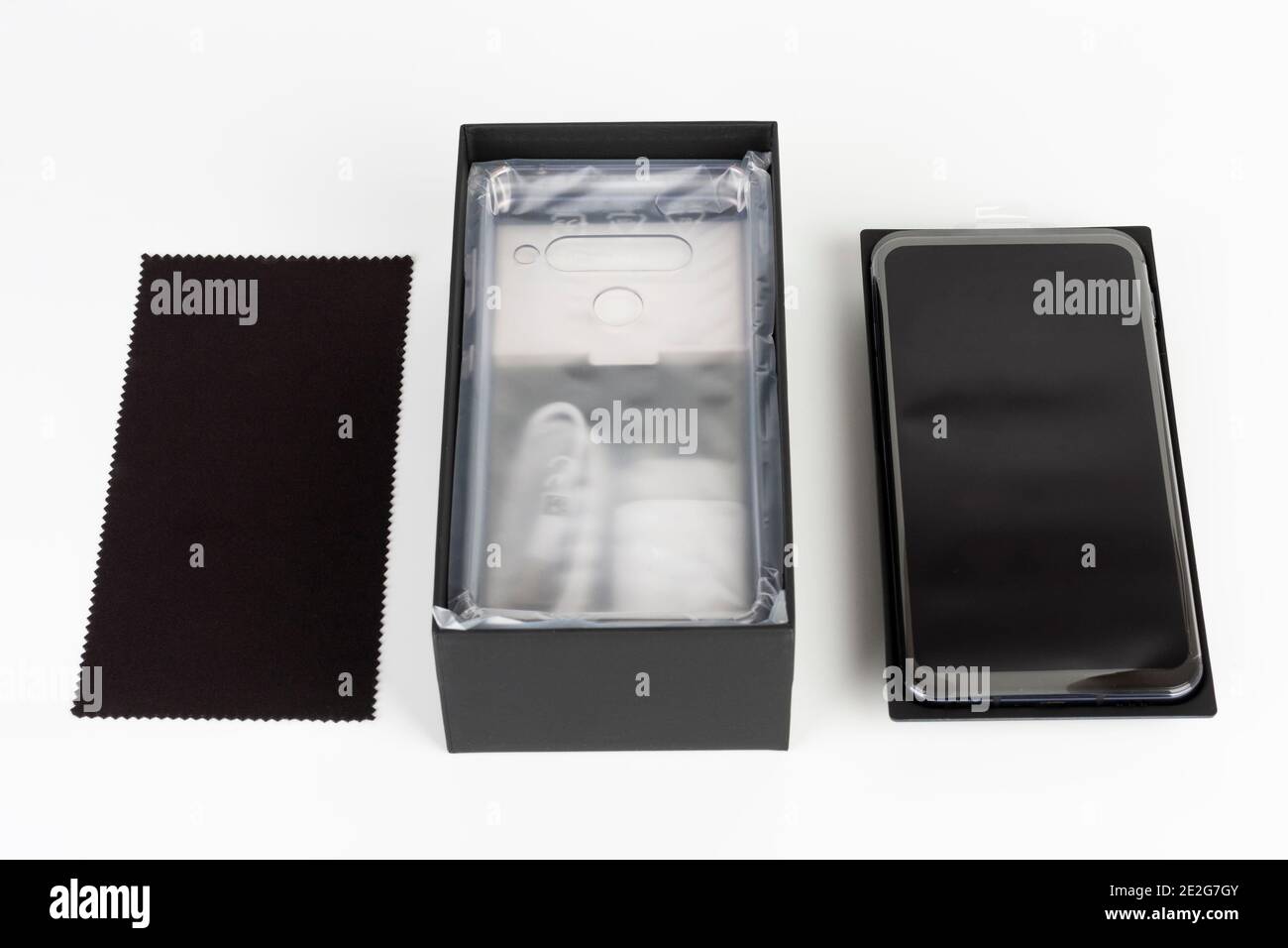 Unboxing of touchscreen smartphone, paper box and clean cloth. Studio ...