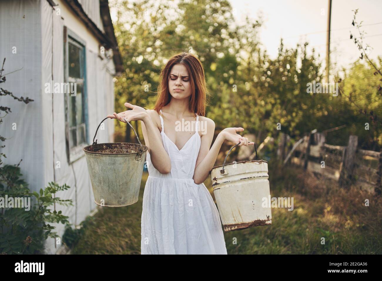 Water in yellow buckets hi-res stock photography and images - Alamy