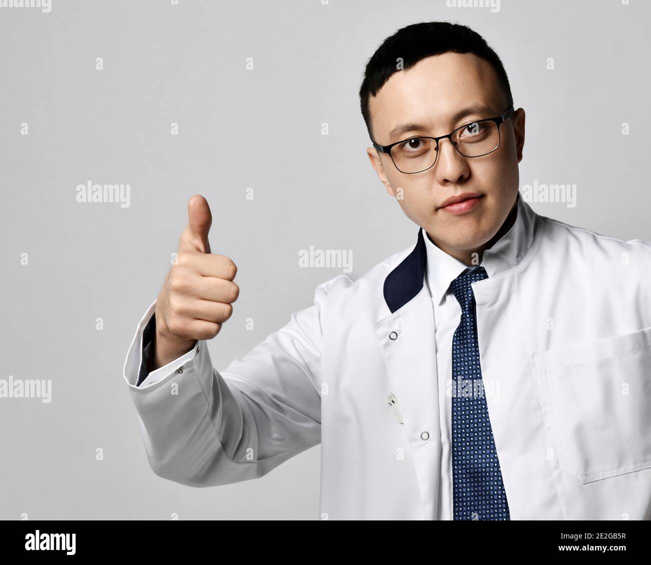 Portrait of young man doctor urologist or proctologist in white medical ...