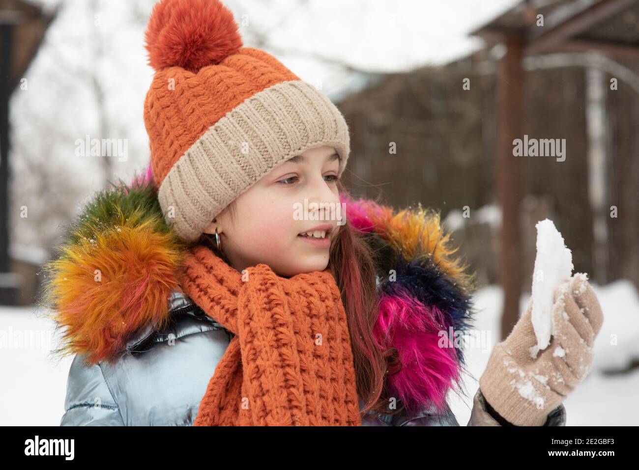 Winter portrait of young girl in her warm clothing. Teenage girl in a ...