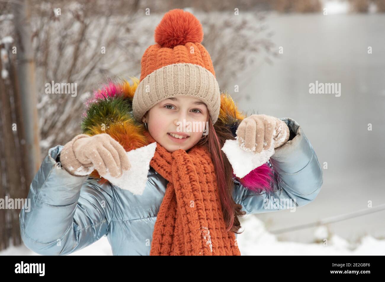 Winter portrait of young girl in her warm clothing. Teenage girl in a ...