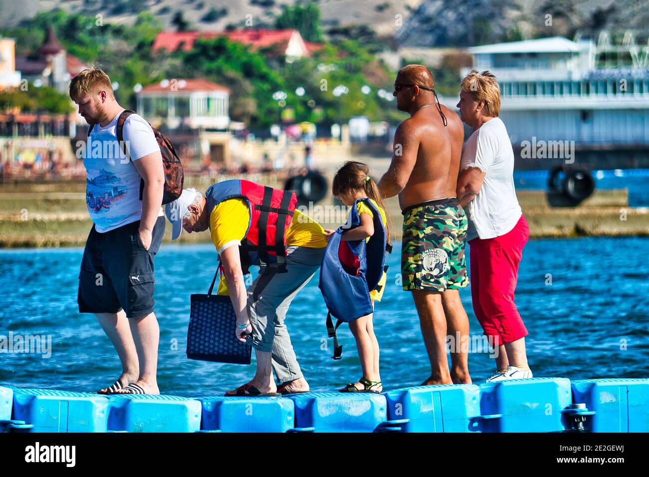 Group people walk along pier hi-res stock photography and images - Alamy