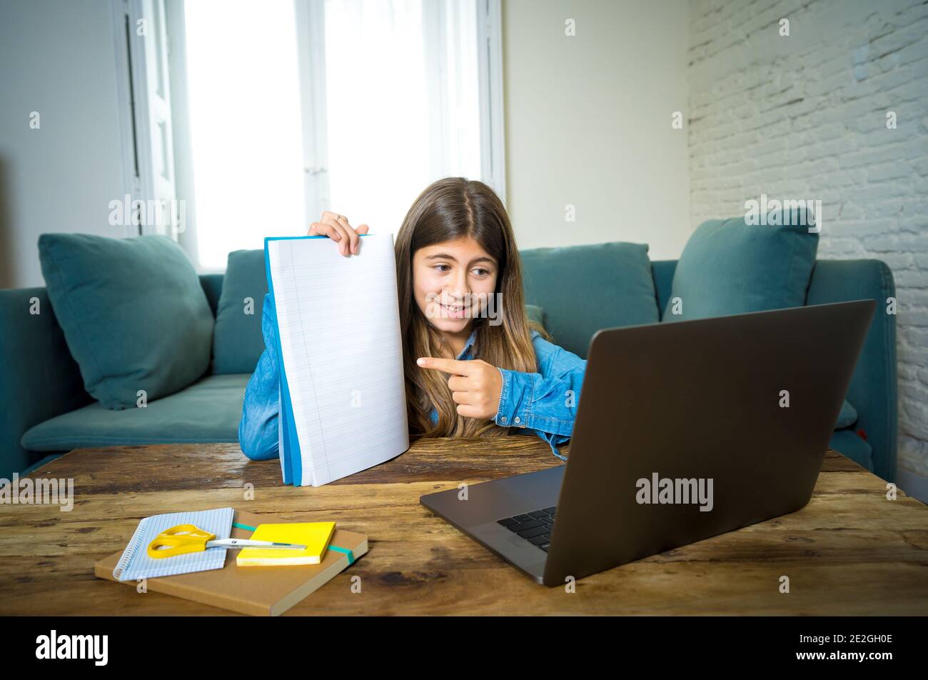 Happy Teen girl on laptop studying online in virtual remote class on ...