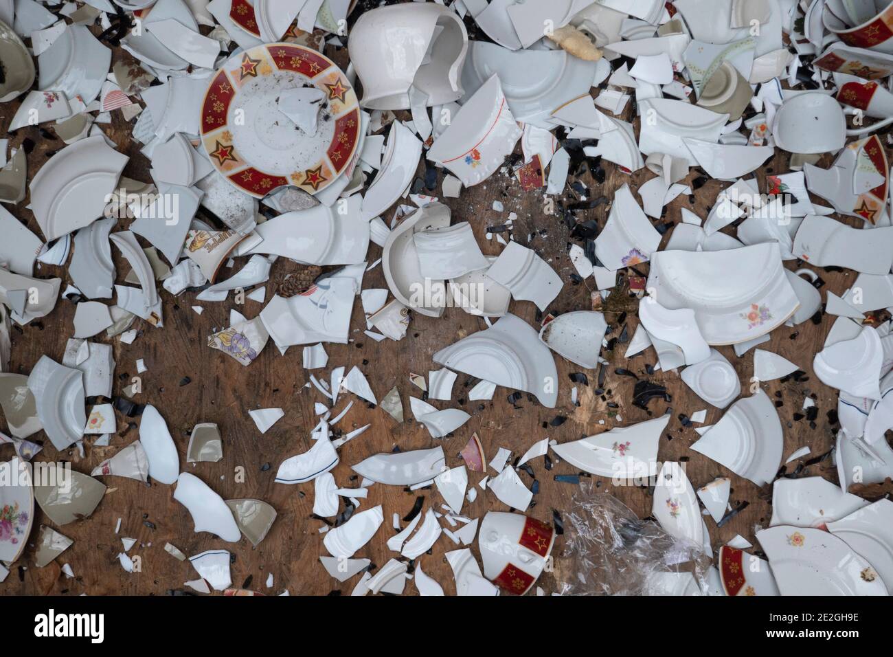 Broken dishes scattered on floor Stock Photo - Alamy