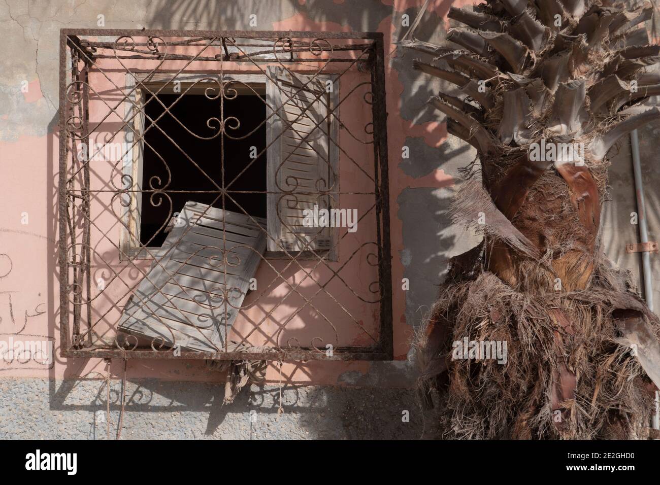 Ornate grate over window with broken shutter, Taghazout, Morocco Stock ...
