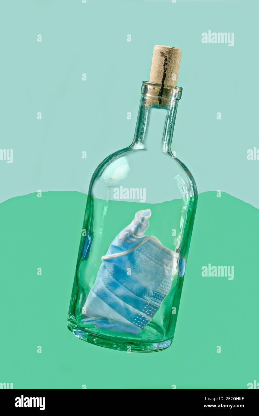 Protective face mask inside bottle with cork Stock Photo - Alamy