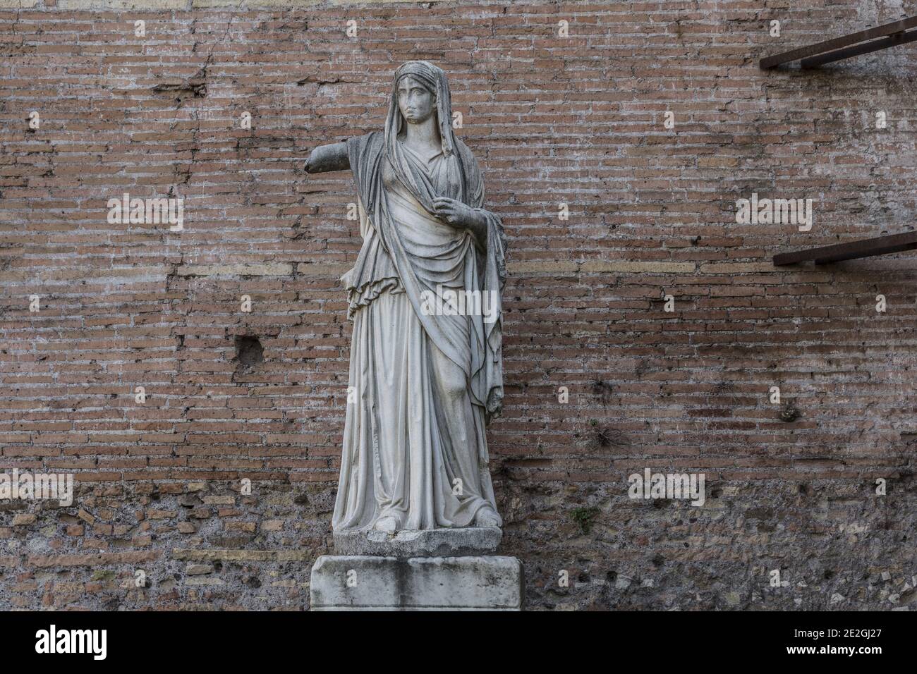 Closeup of the statue of Vestal Virgin in the House of Vestal in Roman ...