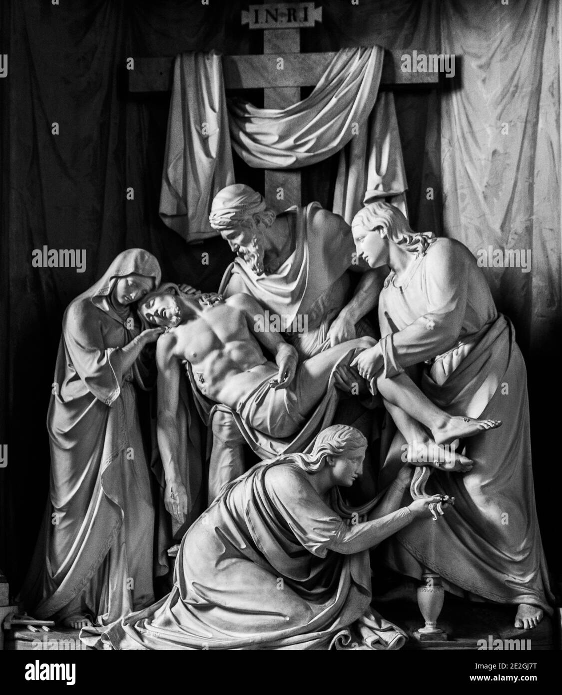 Greyscale shot of the stone statues of Jesus Christ and saints Stock ...