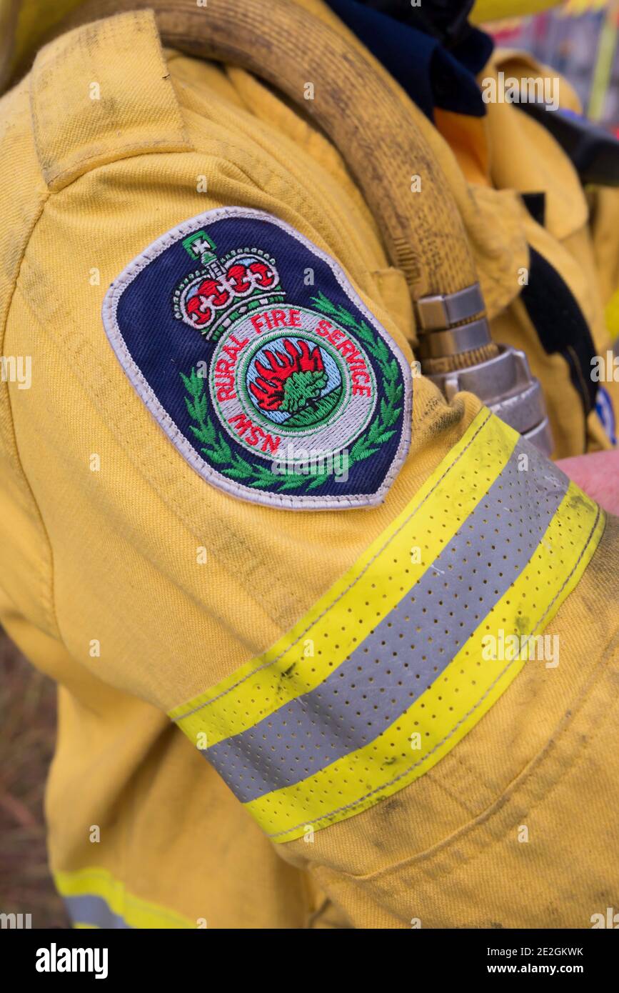 A close up side on view of a rural fire service uniform and logo badge ...