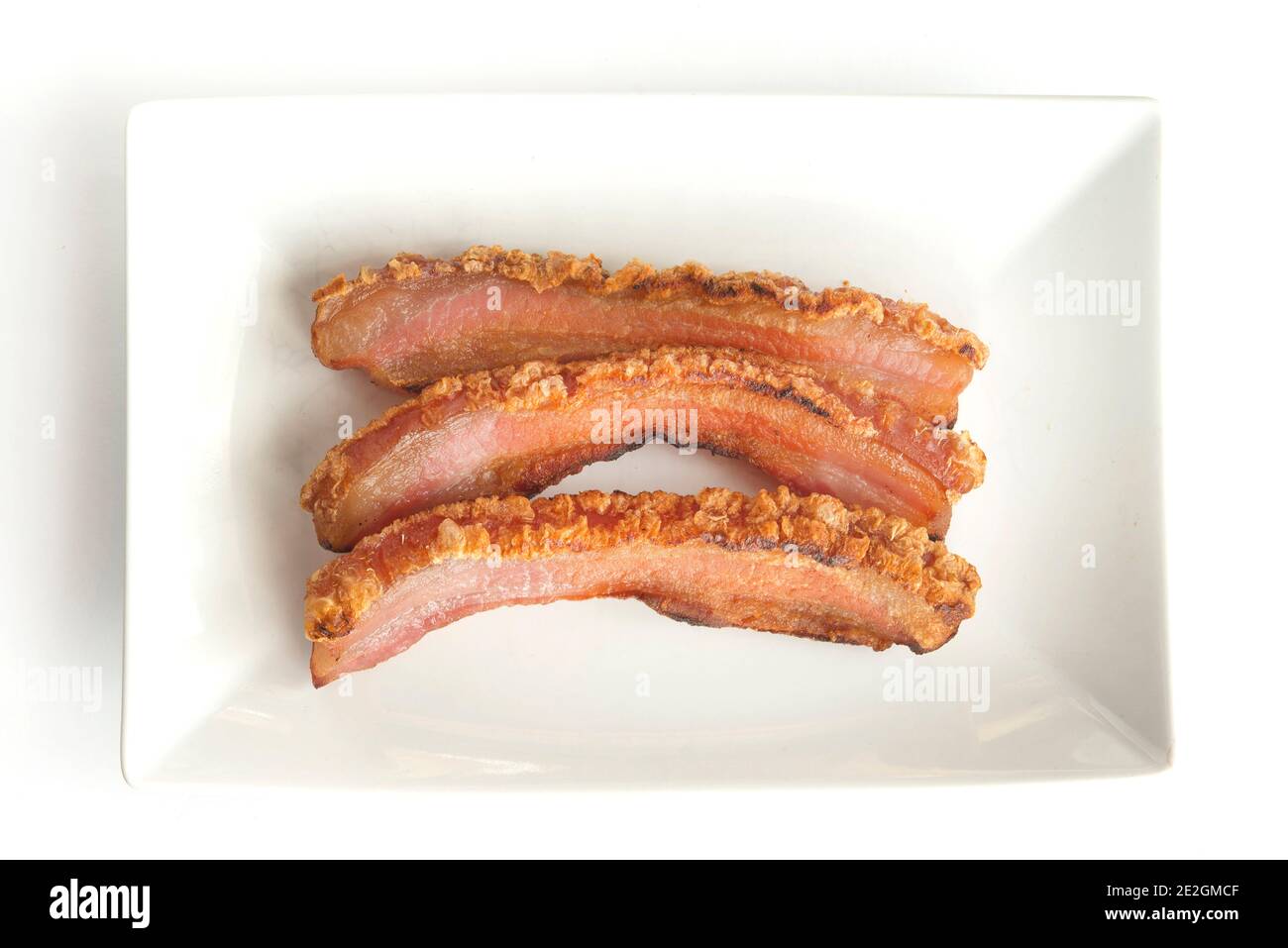 slice of bacon white background Stock Photo - Alamy