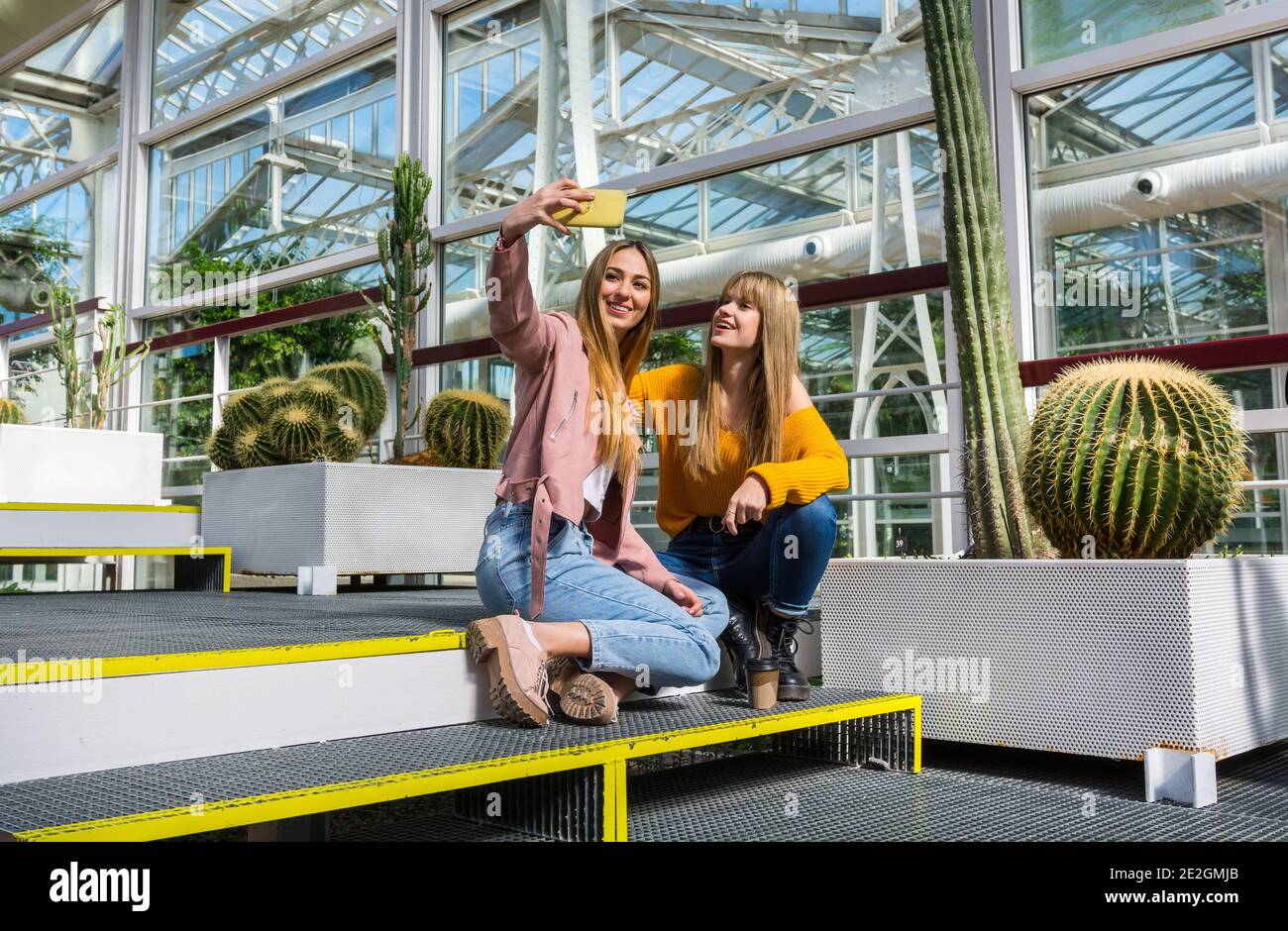 Two friends walk through a park and tell each other their secrets while ...