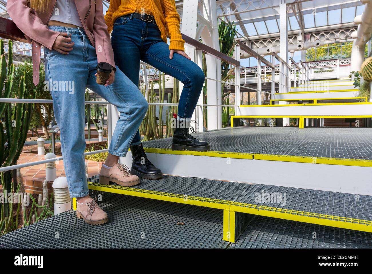 Two friends walk through a park and tell each other their secrets while ...