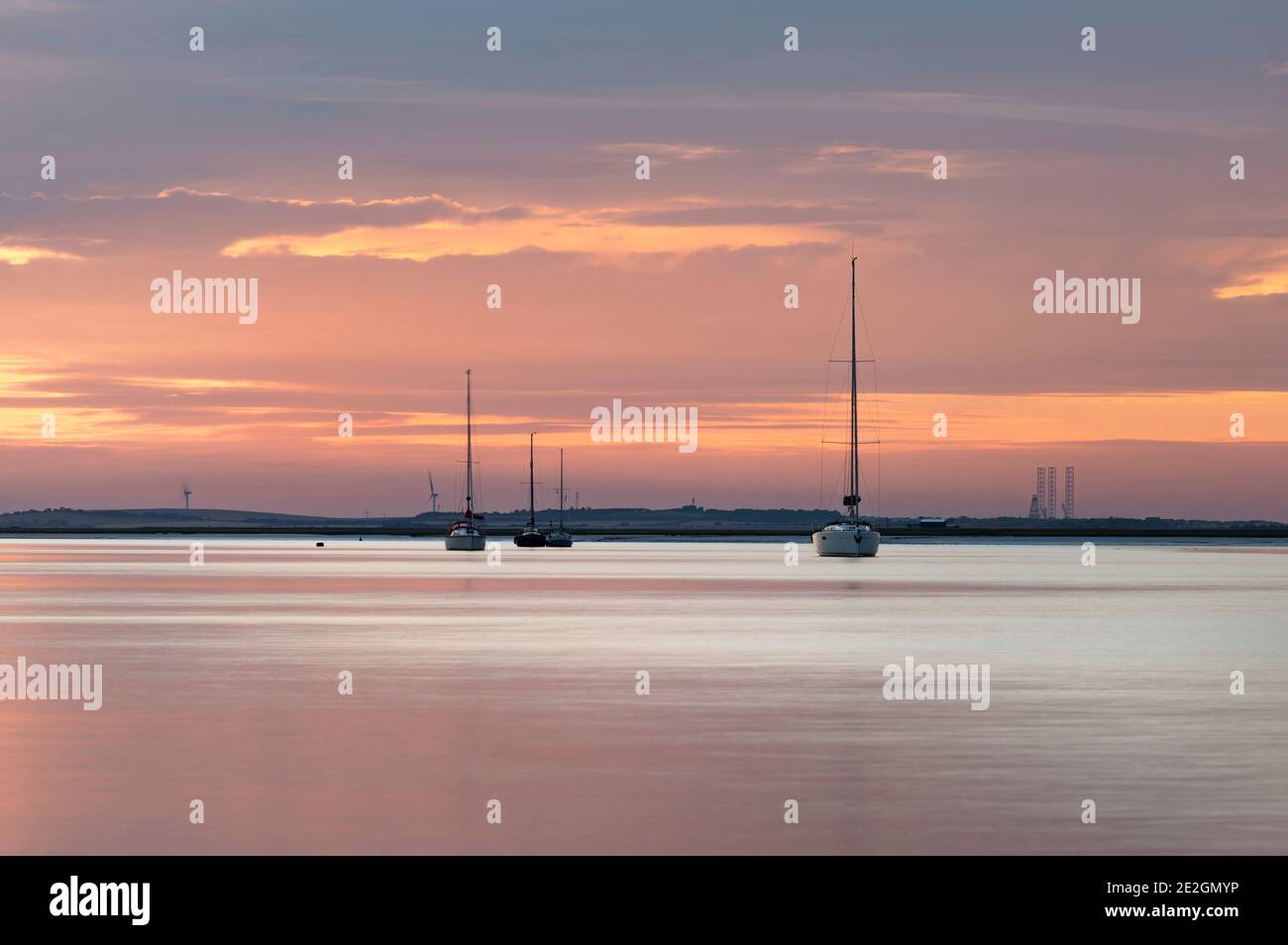 Boats on the Swale estuary in Kent at sunset. Taken from Harty Ferry ...
