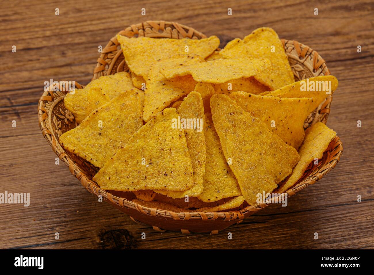 Mexican crunchy corn nachos triangle heap Stock Photo - Alamy