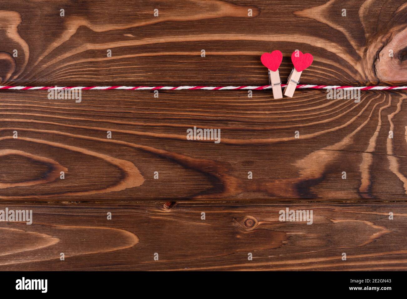 Two little hearts symbol of St. Valentine's day on a clothespin and ...