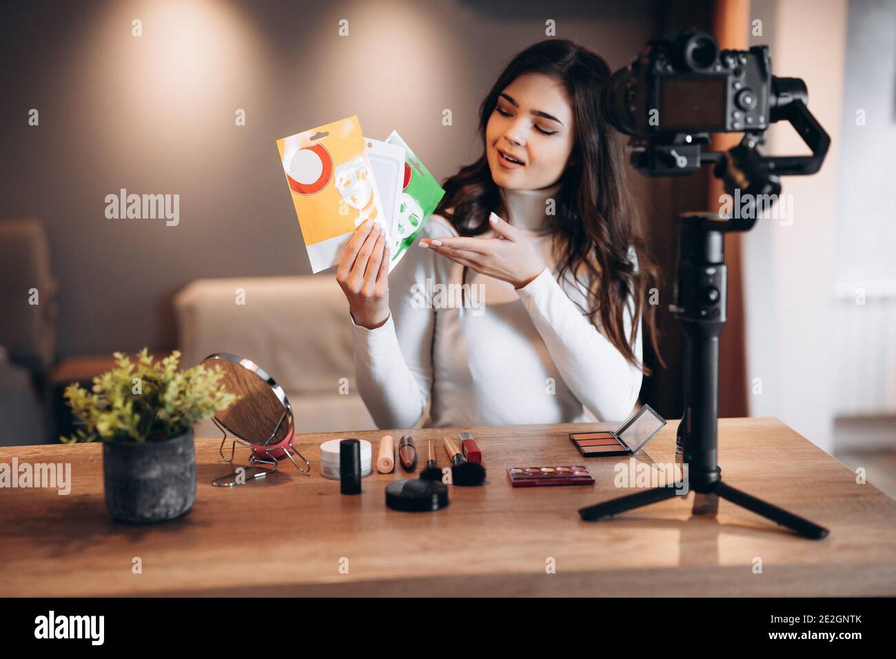Beauty blogger nice female filming daily make-up routine tutorial on ...