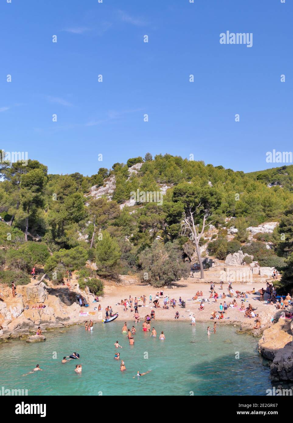 Tourists on the beach, rocky inlet Calanque de Port-Pin, Calanques ...