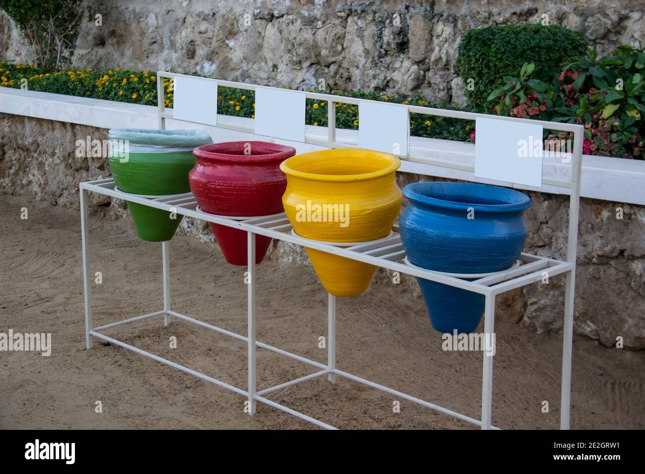 Colorful Waste sorting pots. Different colored bins for collection ...