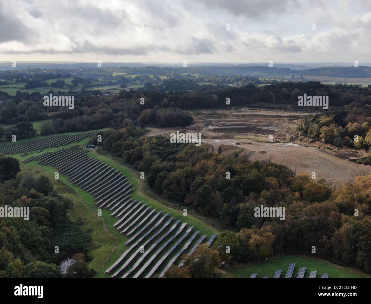 aerial view of a solar farm and quarry in open rolling countryside ...
