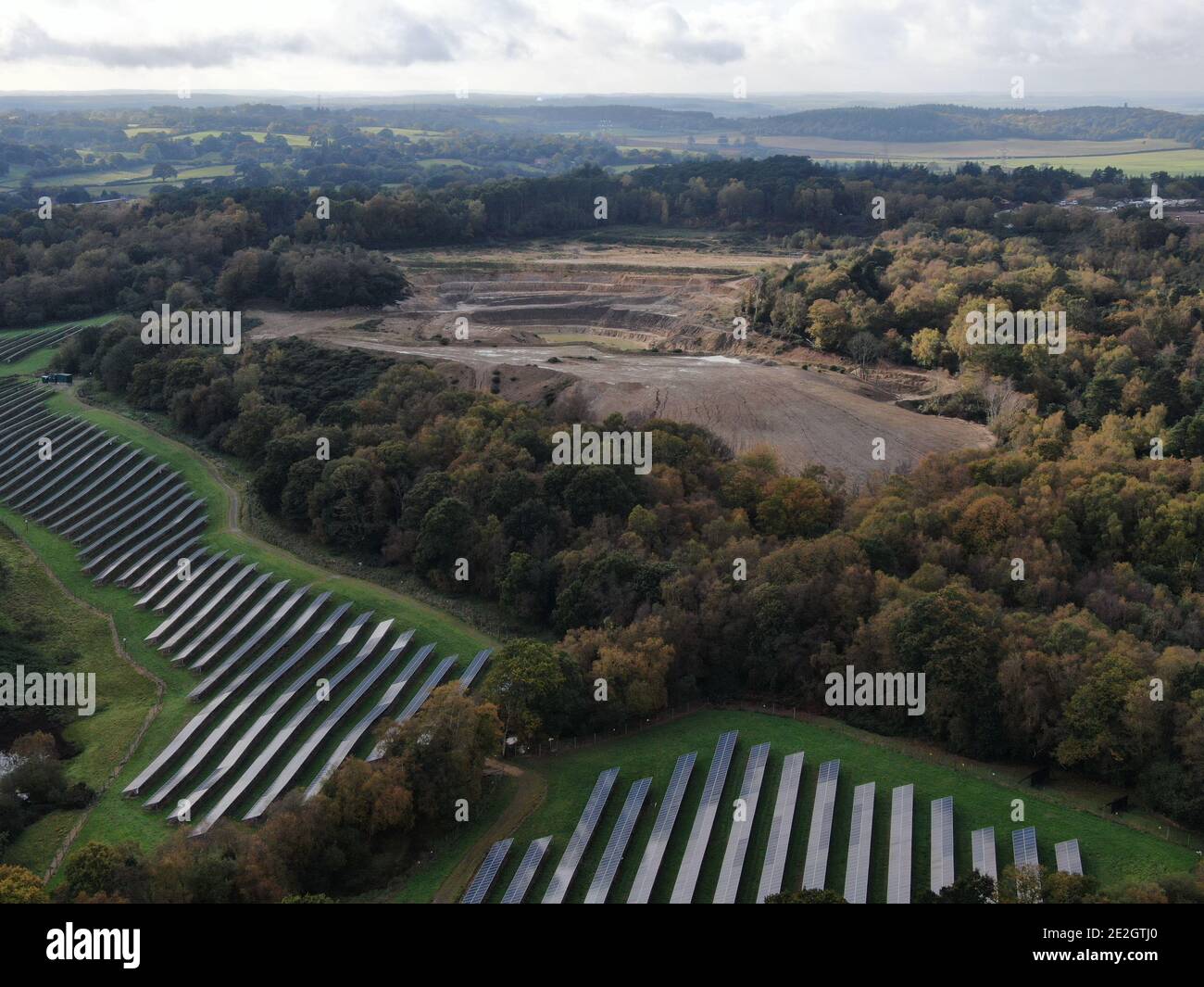 aerial view of a solar farm and quarry in open rolling countryside ...
