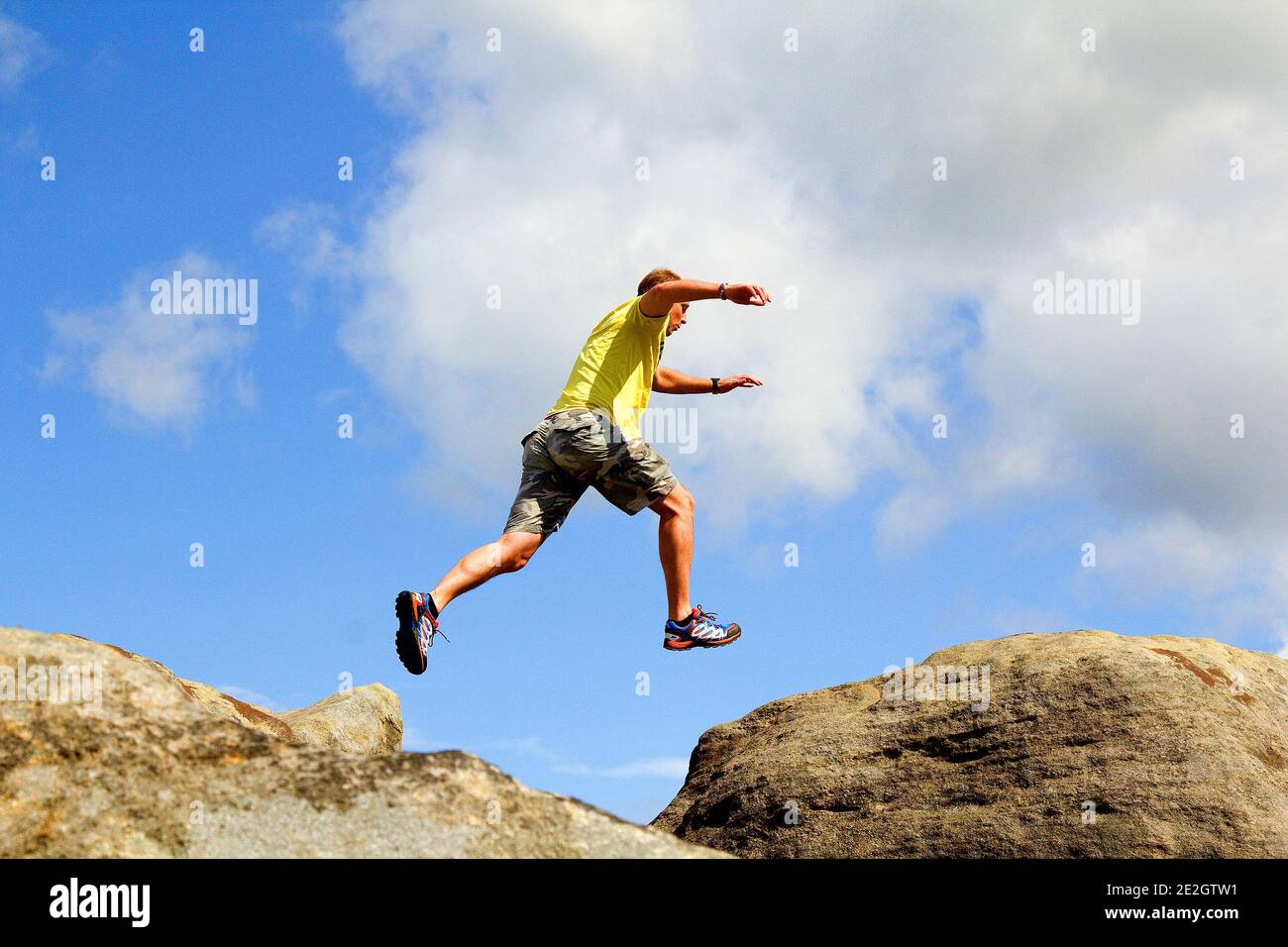 Man jumping off rock hi-res stock photography and images - Alamy