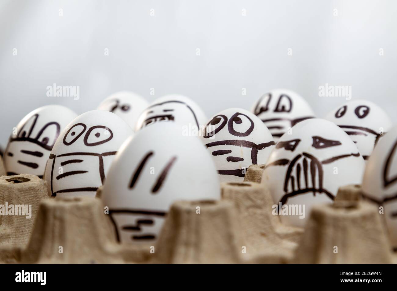 concept of quarantine easter. close up of set of Easter eggs with drawn ...