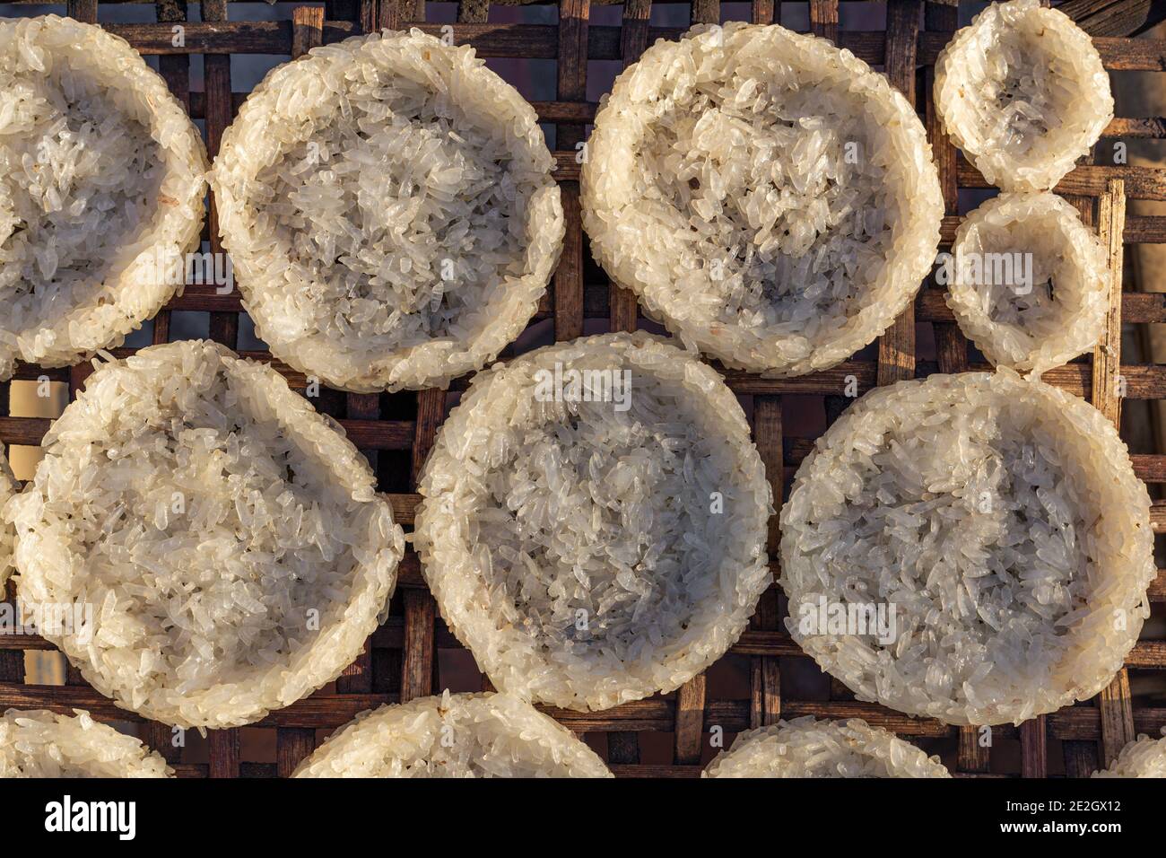Rice cakes drying outside, Laos Stock Photo - Alamy