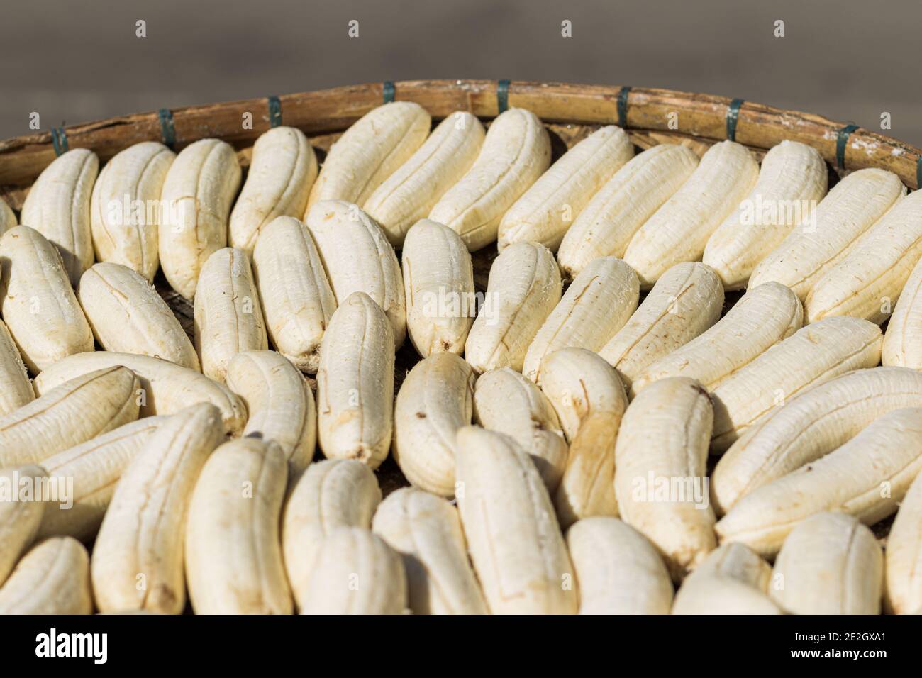 Small, peeled bananas drying in the sun; Laos Stock Photo - Alamy