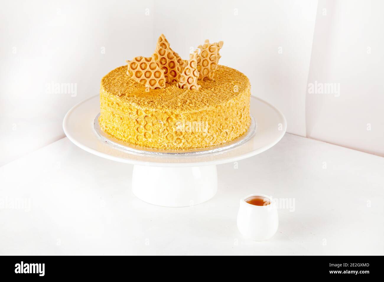 Golden honey seven layered cake with honey comb biscuit Stock Photo - Alamy