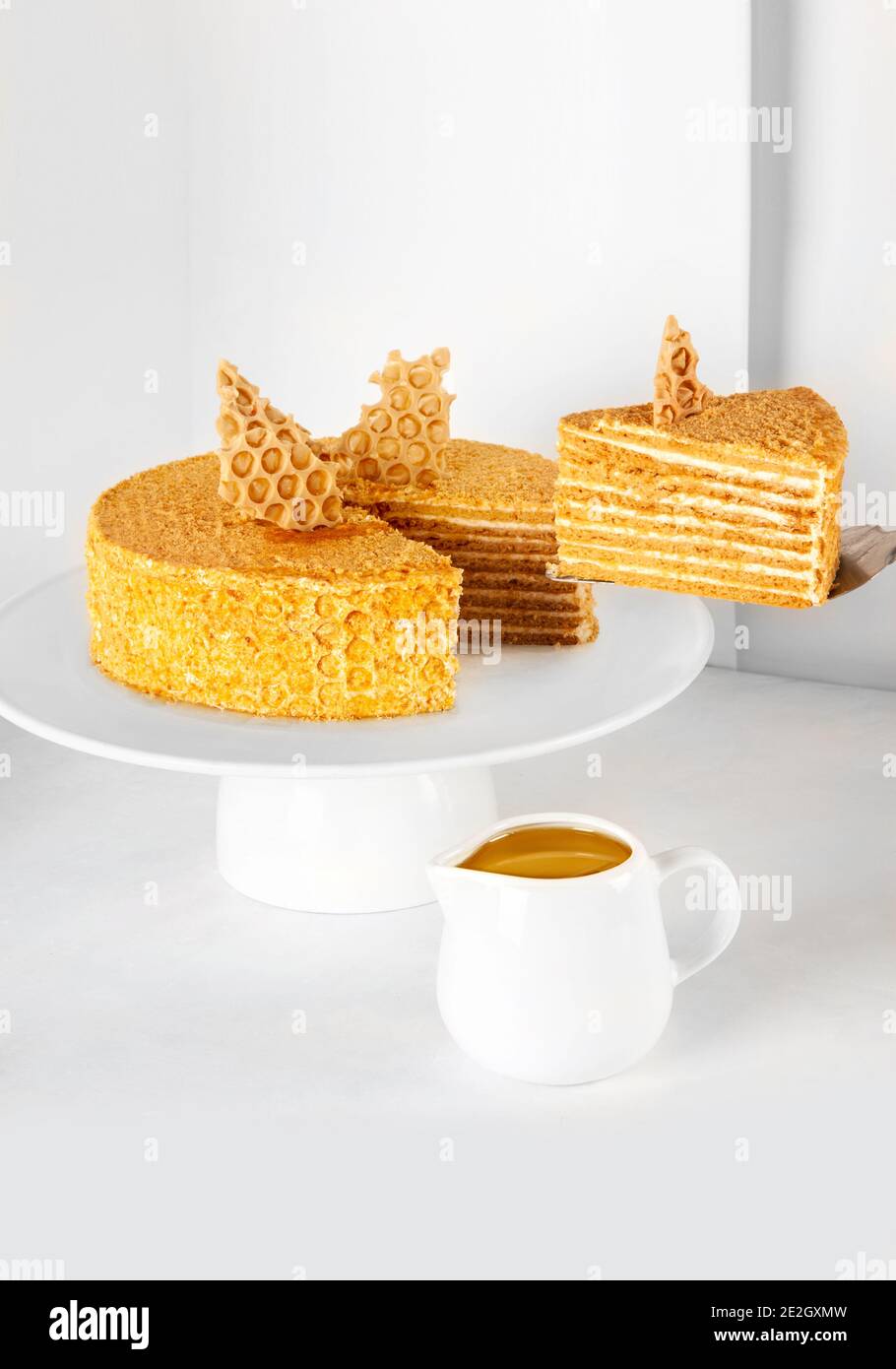 Golden honey seven layered cake with honey comb biscuit Stock Photo - Alamy