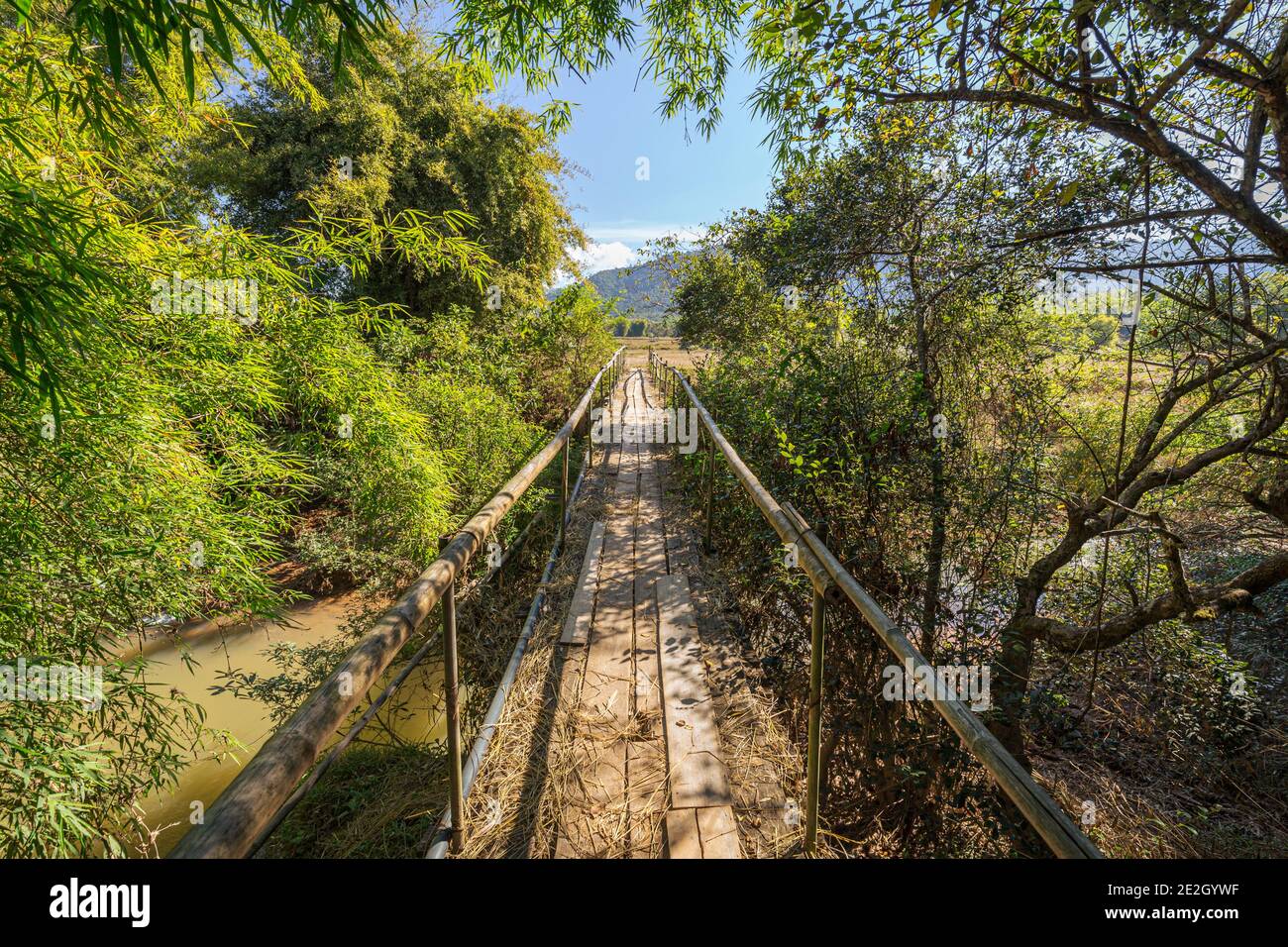 Footbridge in rural Laos Stock Photo - Alamy