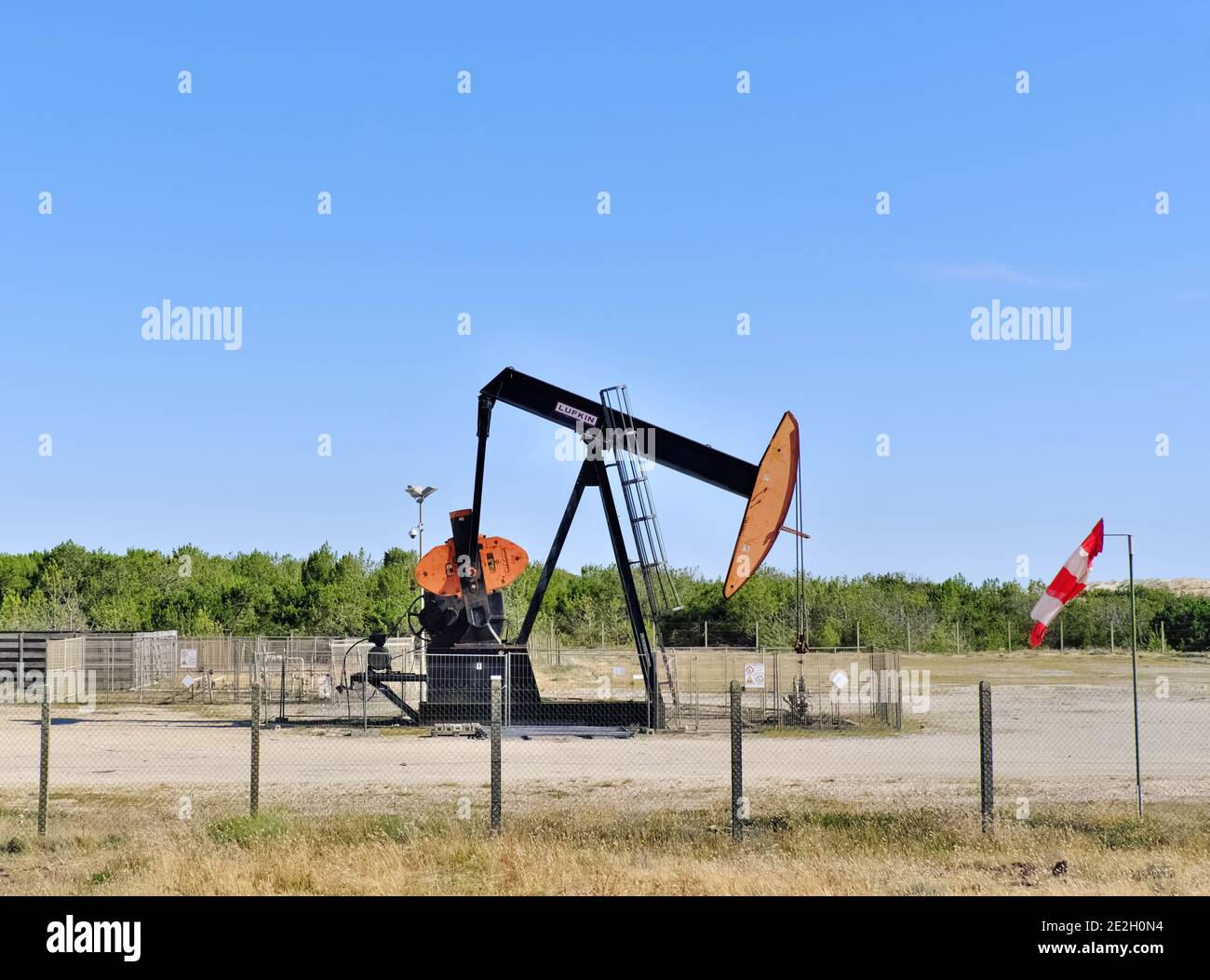 Oil rig on the peninsula of Cap Ferret (south-western France). Pumpjack ...