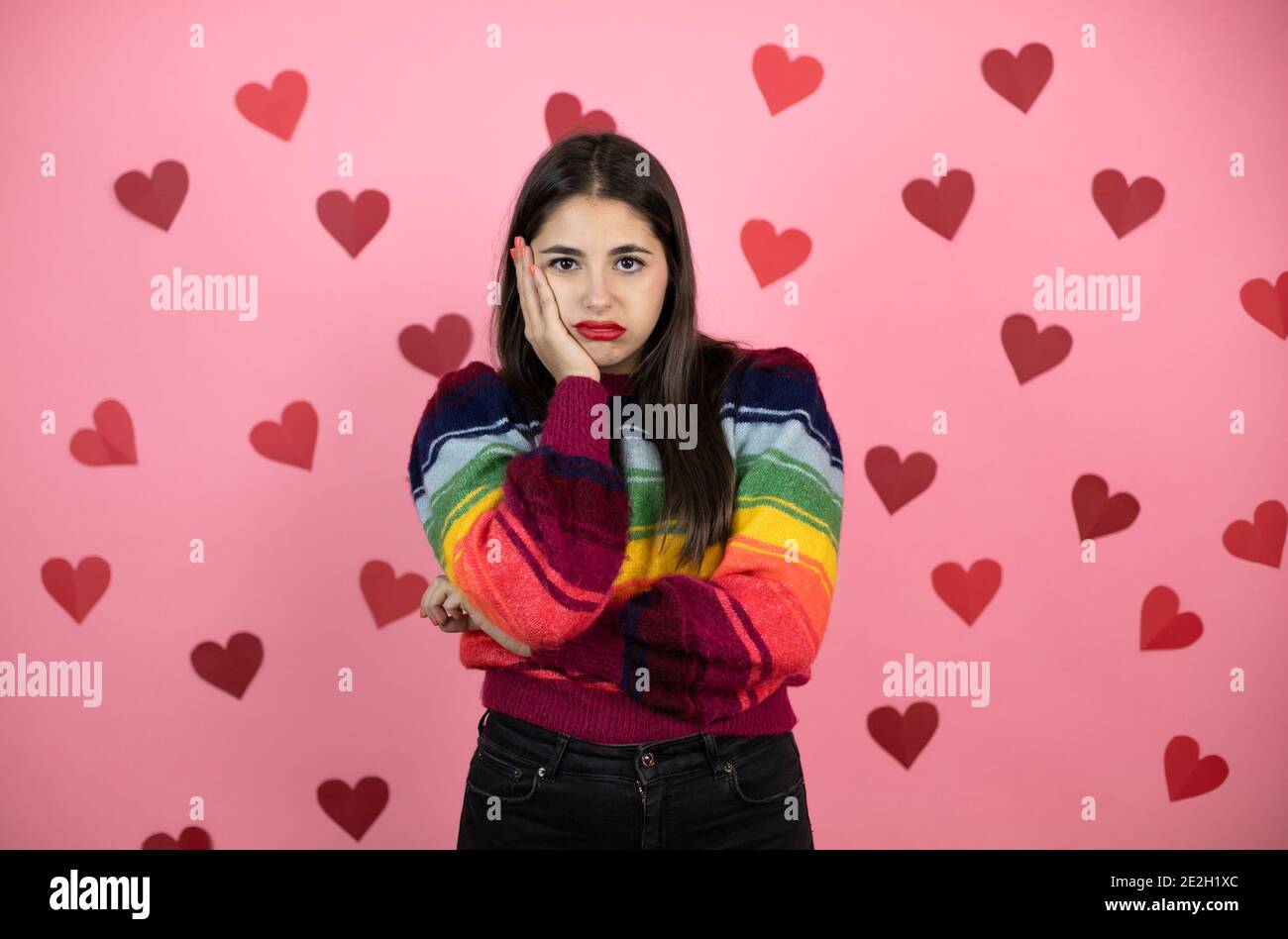 Young beautiful woman over pink background thinking looking tired and ...