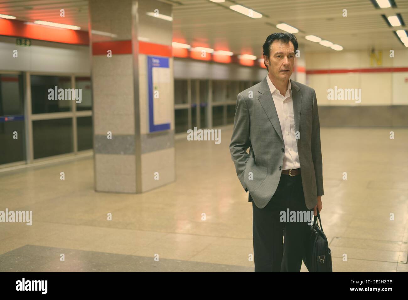 Mature handsome businessman exploring around the city Stock Photo - Alamy