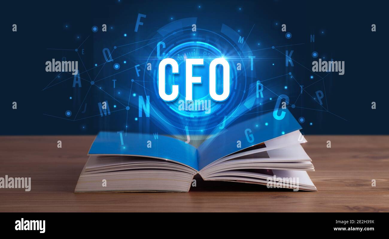 CFO inscription coming out from an open book, digital technology ...