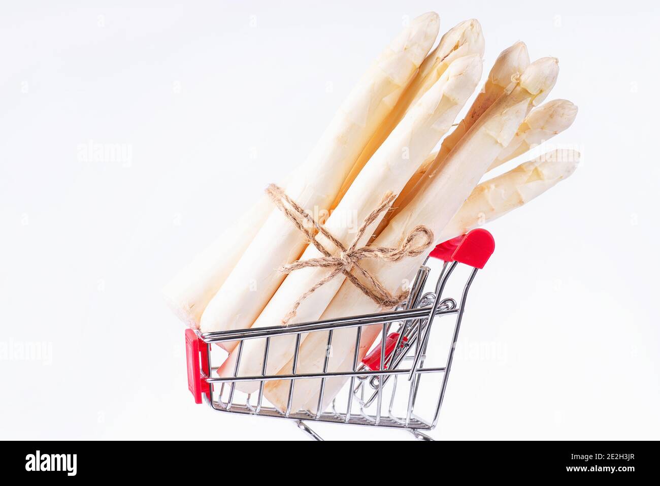 Raw Organic White Asparagus.Fresh vegetables tied with a string taken ...