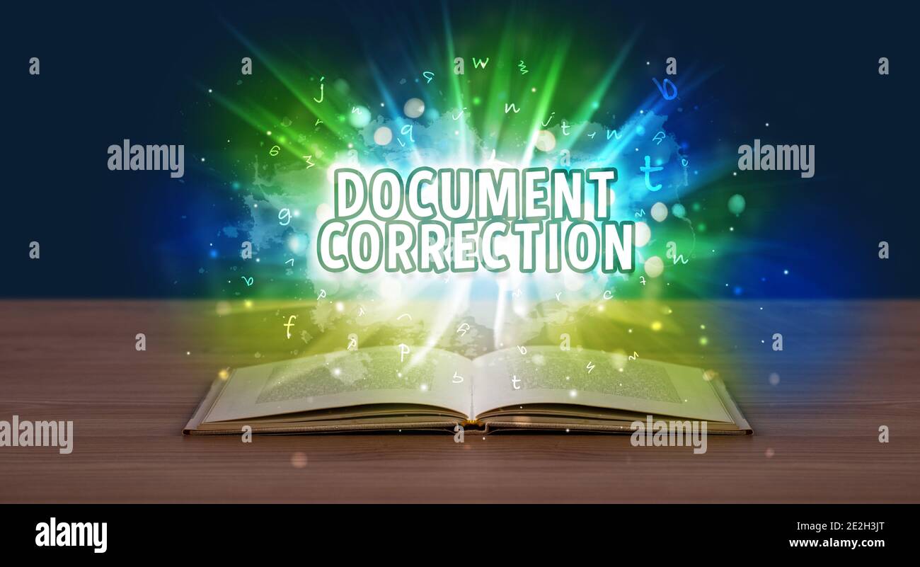 DOCUMENT CORRECTION inscription coming out from an open book ...