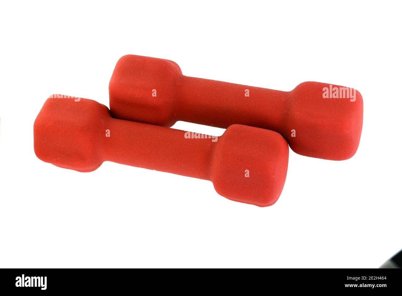 Two of red dumbbells, isolated on white background Stock Photo - Alamy
