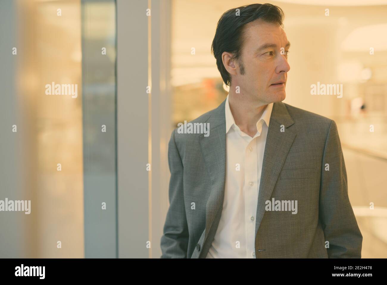 Mature handsome businessman exploring around the city Stock Photo - Alamy