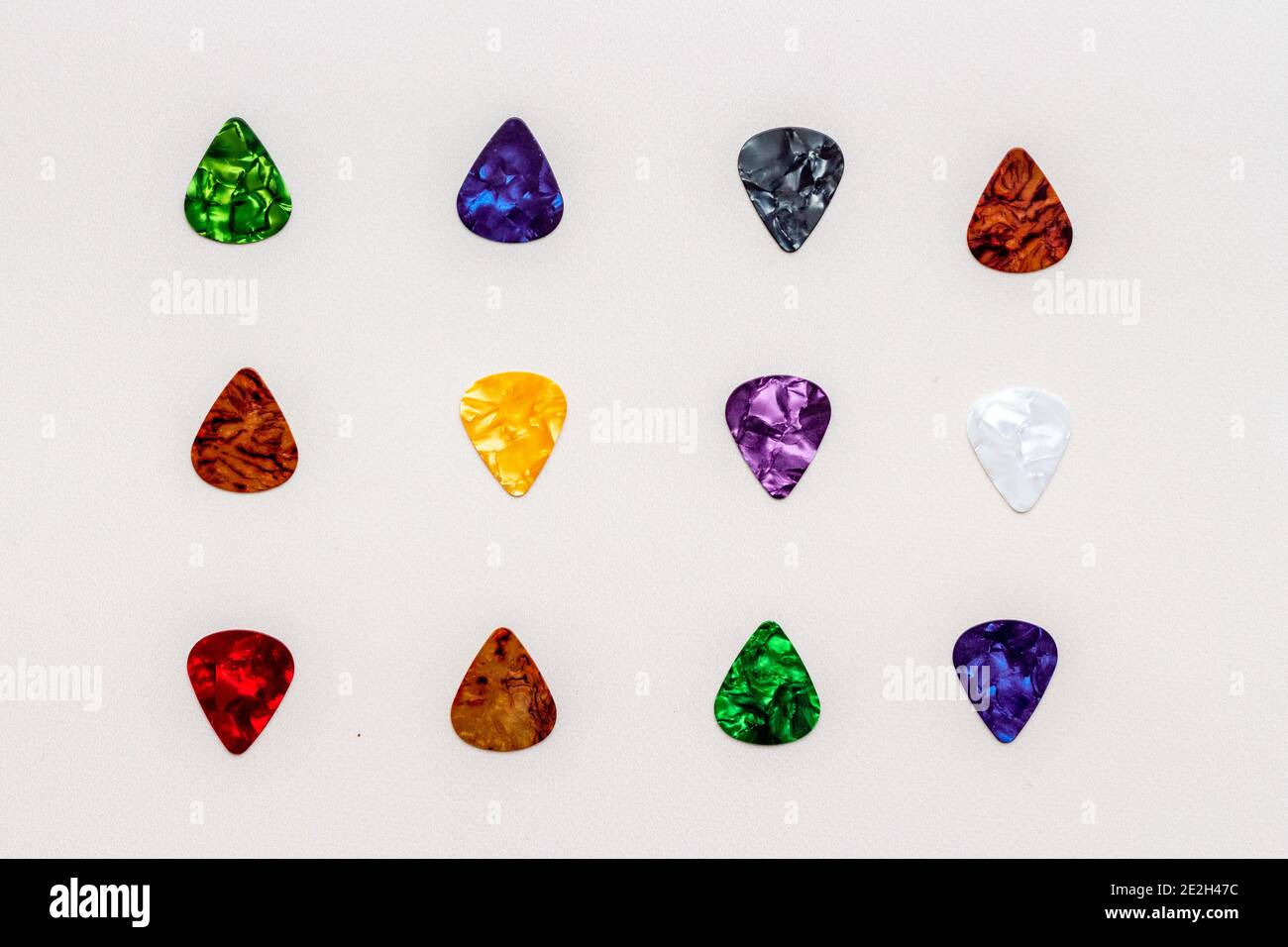 Guitar picks pattern. top view. Music background Stock Photo - Alamy