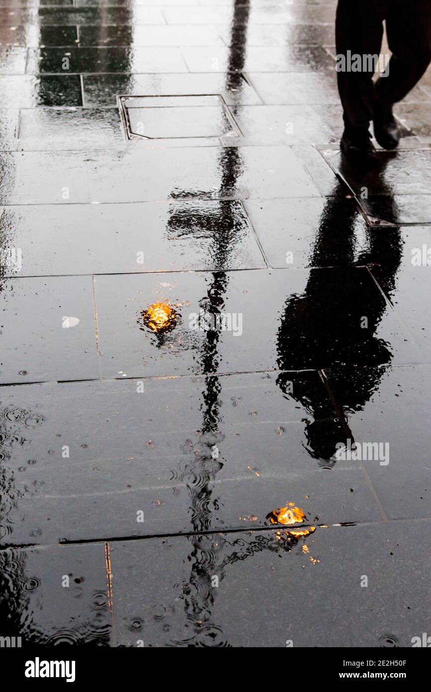 Silhouette of a walker reflected in the rain Stock Photo - Alamy