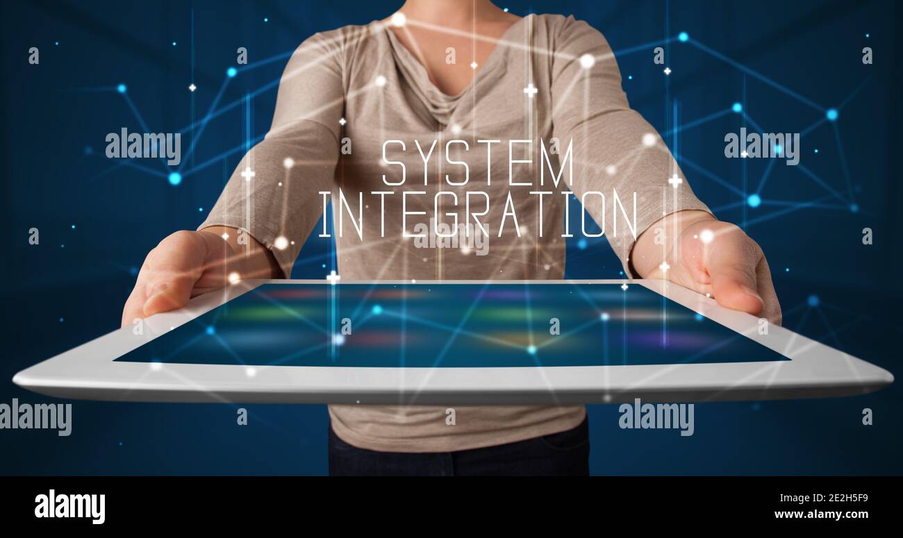 Young business person working on tablet and shows the digital sign ...