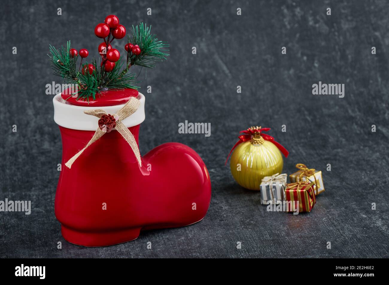 Ceramic red Santa Claus boot, New Year and Christmas conception Stock Photo - Alamy
