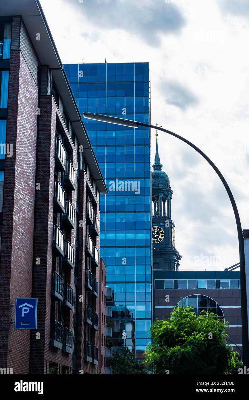 Modern office buildings and the bell tower of the St. Michael Church or ...
