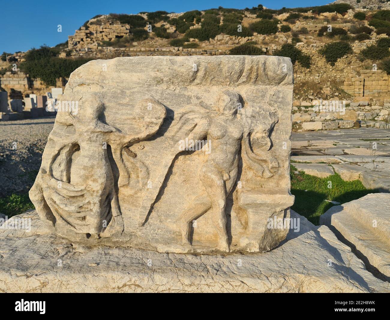Human figures is carved into stone All this is in ancient Knidos Stock ...