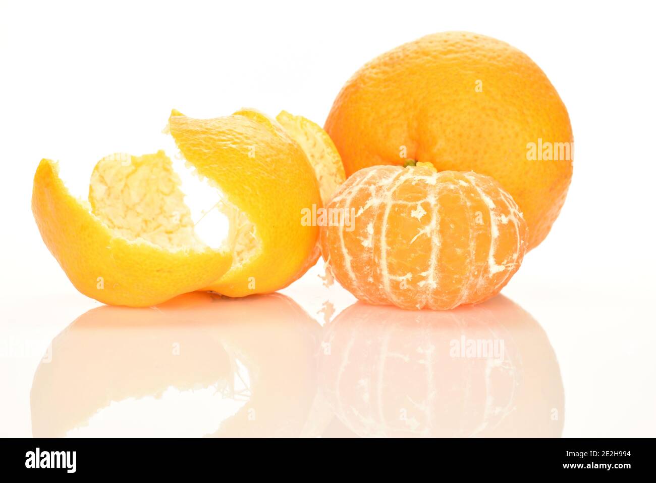 One whole and one peeled (peel lies next to) ripe tasty organic ...