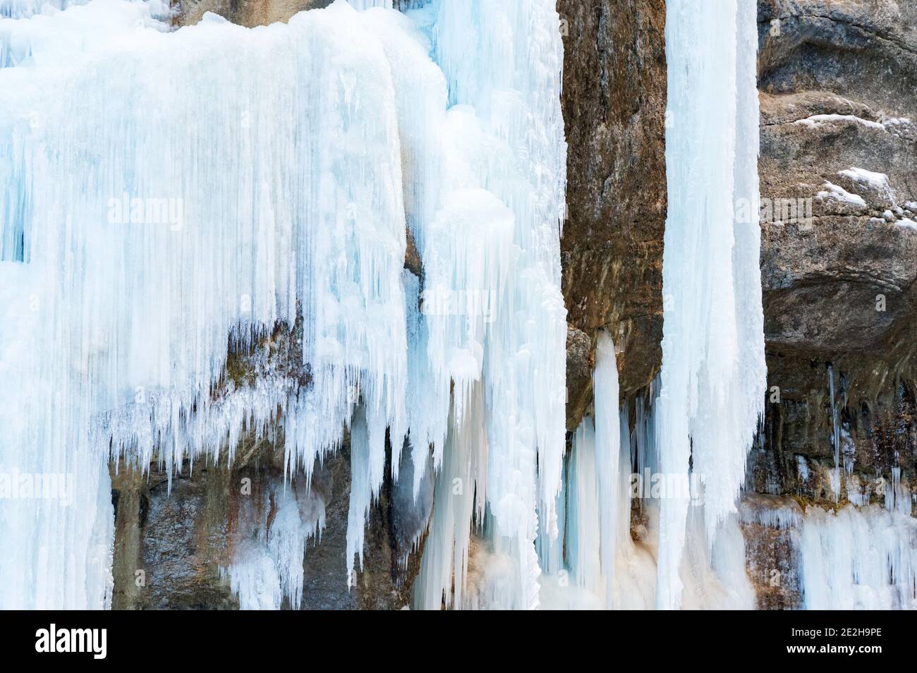 Icicle close up with detail on frozen waterfall. Ice spike hanging can ...