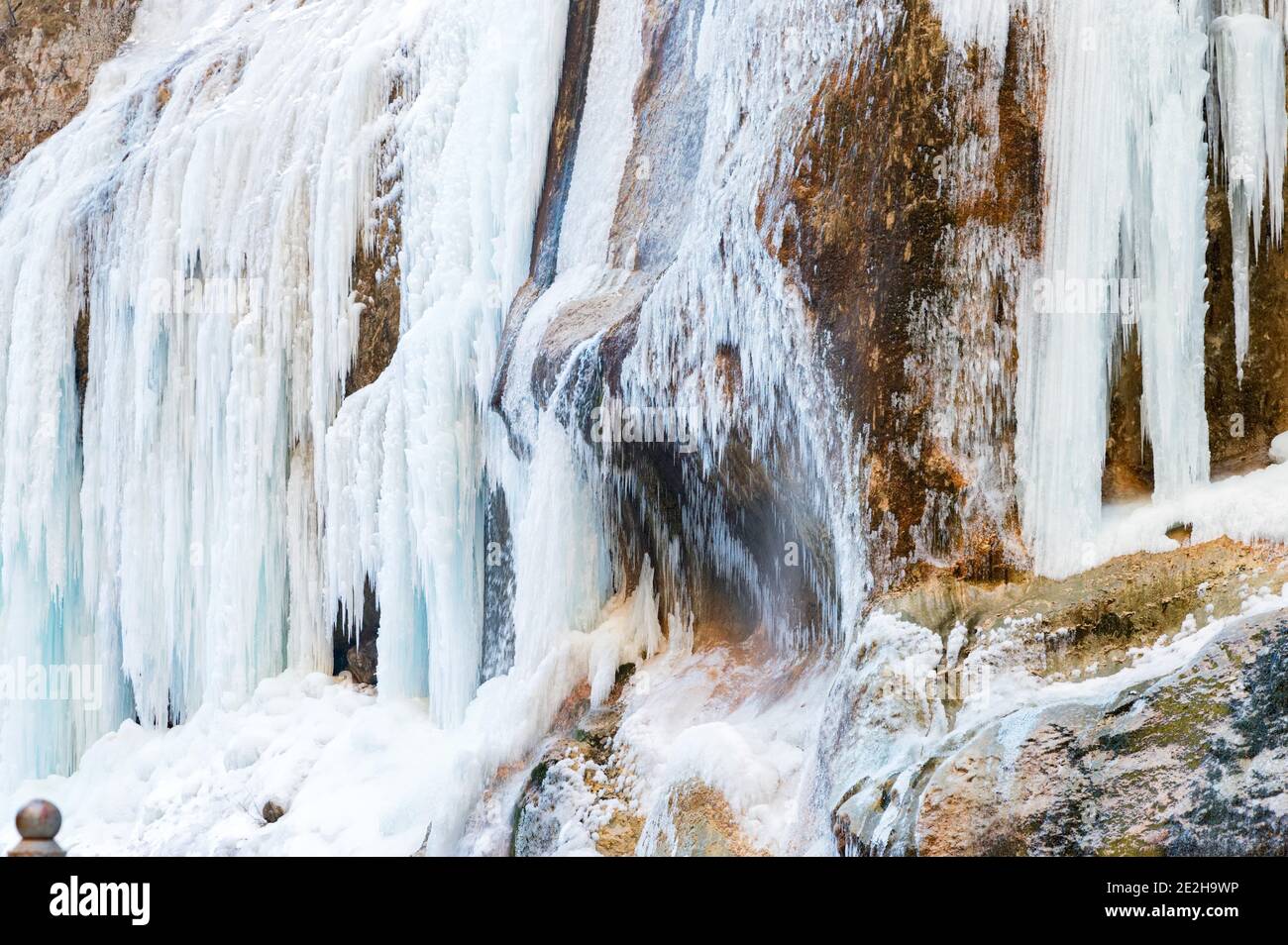 Icicle close up with detail on frozen waterfall. Ice spike hanging can ...