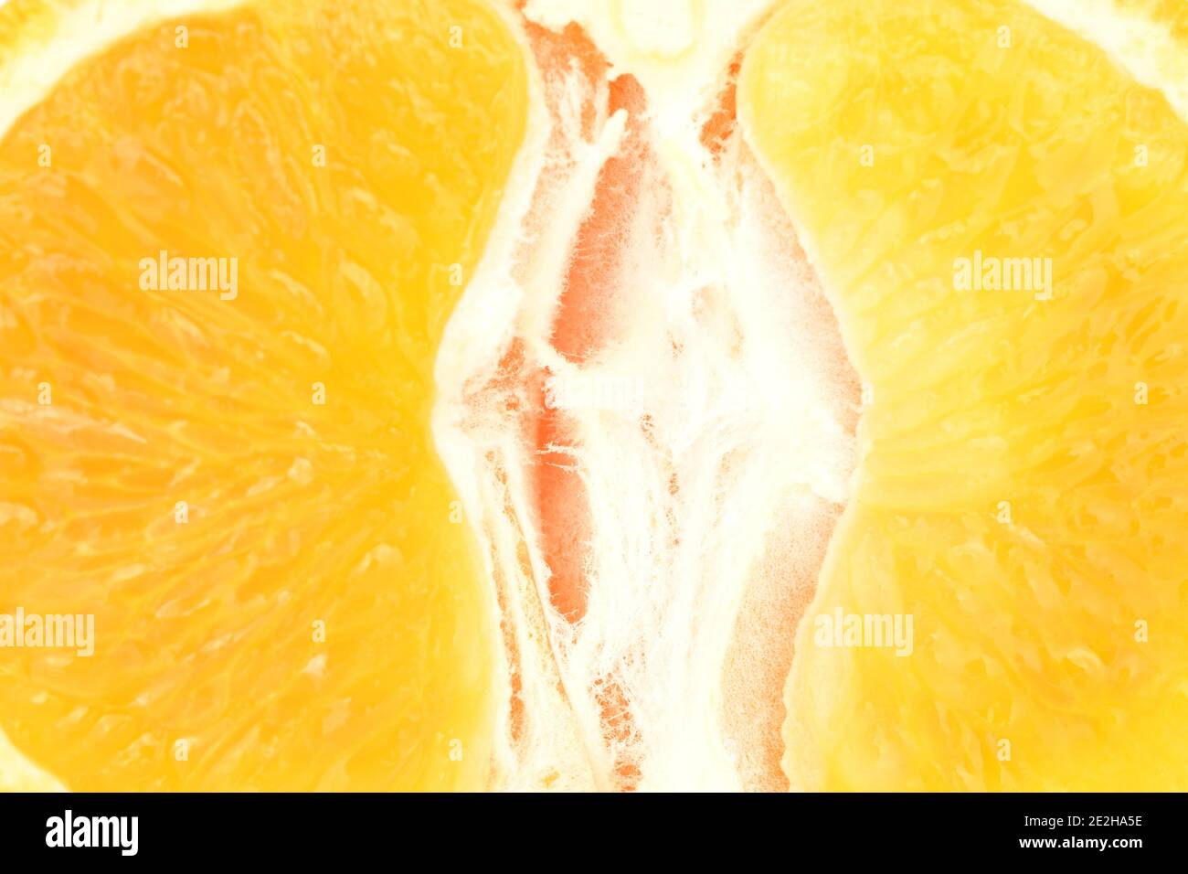 One half cut bright yellow juicy mandarin, macro Stock Photo - Alamy